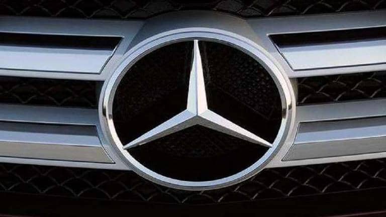 Mercedes-Benz mired in controversy over ad showing model with slanted ...