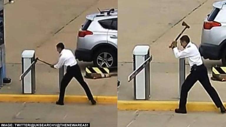 WATCH out of control US pilot attacking parking lot barrier with an axe ...