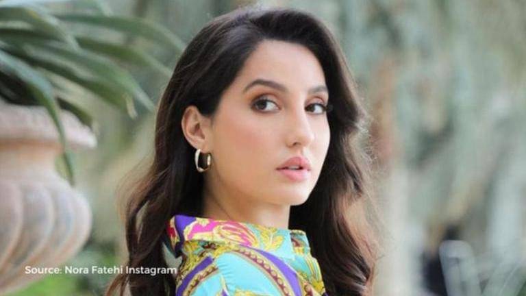 Nora Fatehi strikes a pose in Paris wearing Balmain; model Natalia ...