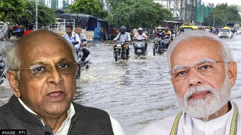 Pm Modi Dials Gujarat Cm To Take Stock Of Rain Situation Assures
