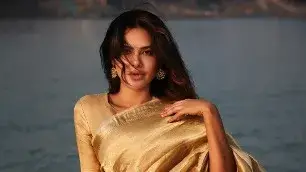 Esha Gupta dons golden silk saree for her Varanasi vacay