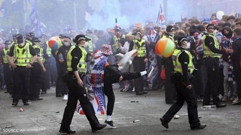 Rangers fans fight with bottles as riot police called to stop blood ...