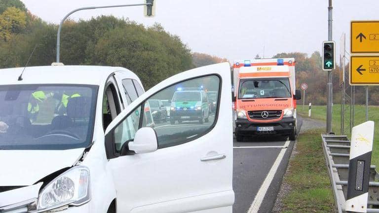 US: Group of people help stop moving car on busy street as woman ...