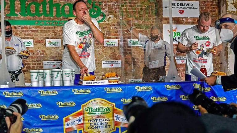 Hot Dog eating champion Joey Chestnut wins 13th title, breaks his own ...