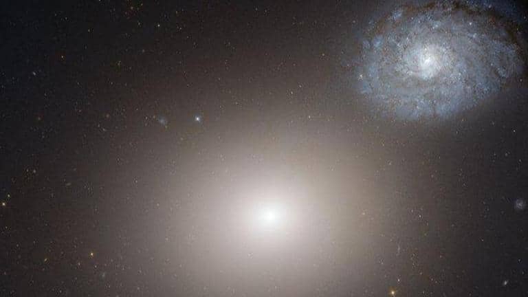 NASA releases classic Hubble image of M60 galaxy with monster ...