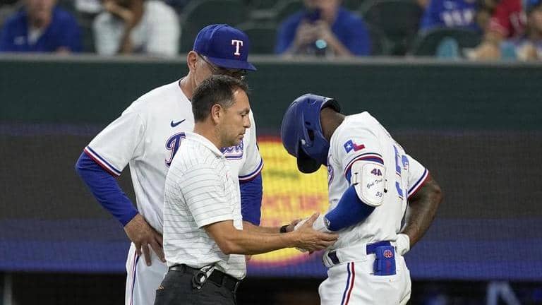 Rangers slugger Adolis Garcia, leading the AL in RBIs, exits game after ...