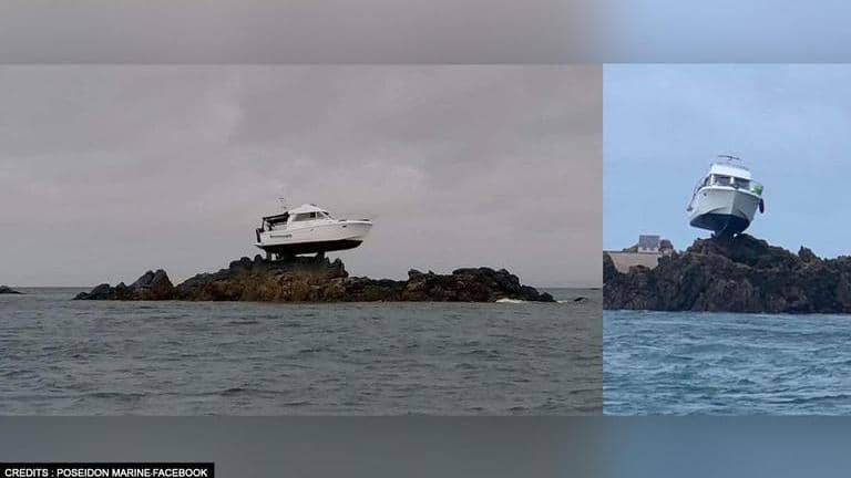 Boat gets stuck on top of rock in English Channel; crew members have ...