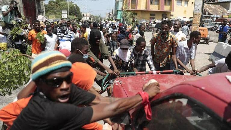Thousands march in Haiti, demanding safety from dangerous gangs as ...