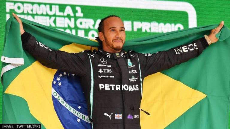 Brazilian GP: Lewis Hamilton fined for removing safety belts to pick ...