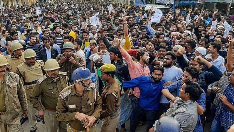 Anti-CAA protest: Police fire in air, 15 vehicles torched by protesters ...