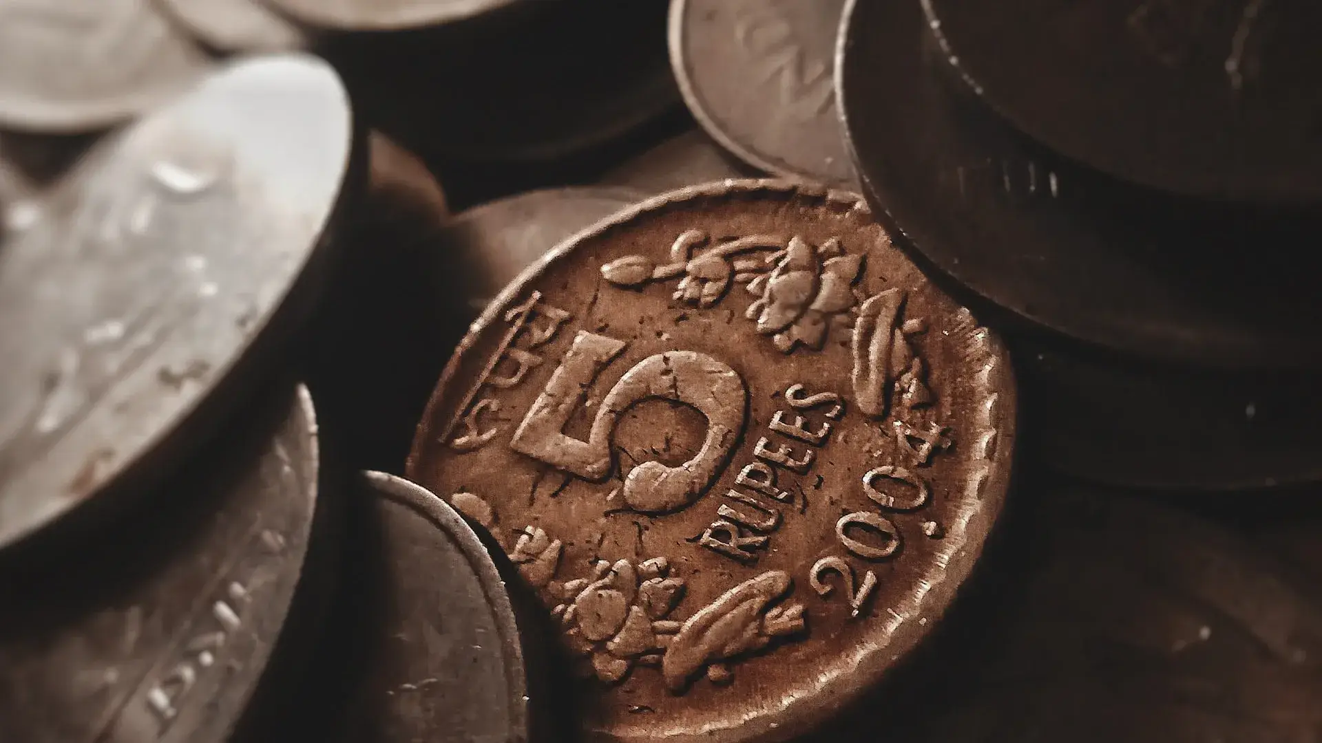 Rupee inches upward on dollar sales by exporters, foreign banks ...