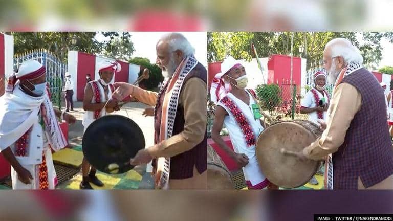 PM Modi tries hand at traditional musical instruments in Manipur ...