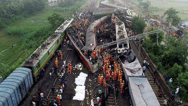 Rescuers attempt to raise buried coach at triple rail crash site ...